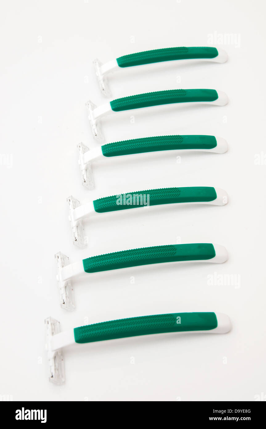 green razors on a white background Stock Photo - Alamy