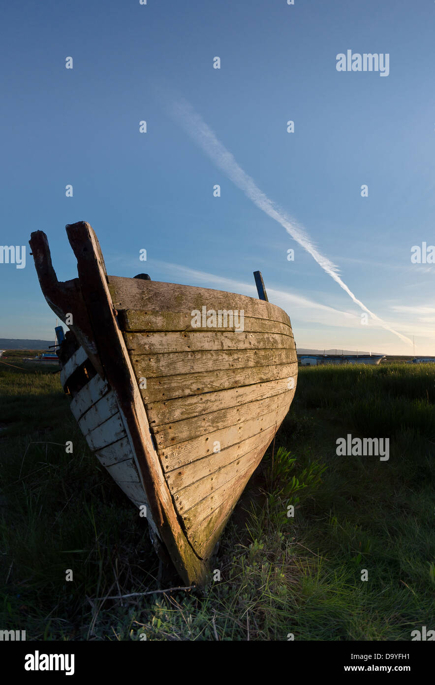 Old boat left on silted up river Stock Photo - Alamy