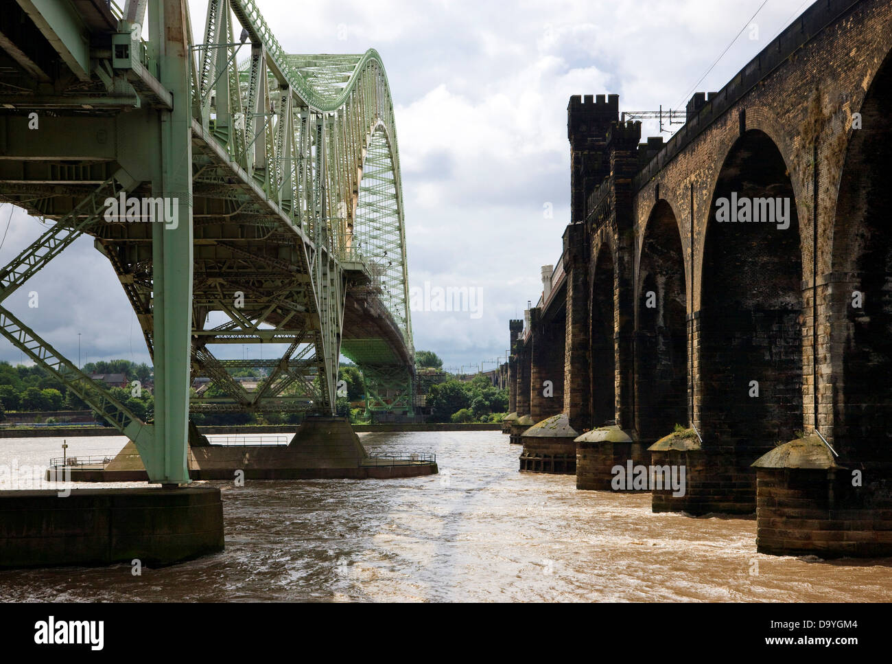 Railway bridge and the Runcorn-Widnes Bridge across the River Mersey ...