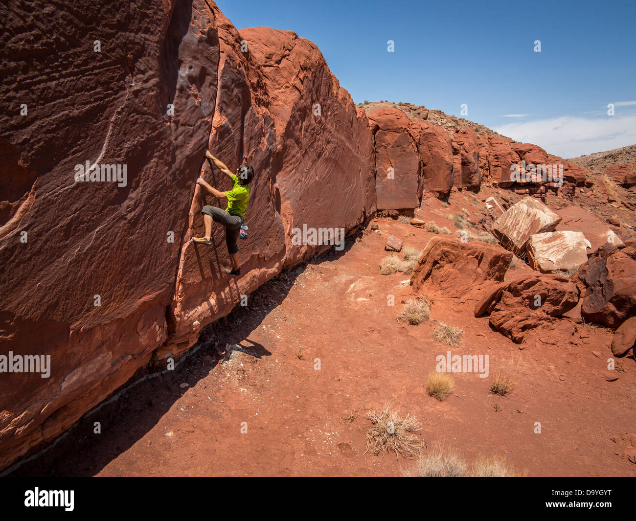 A man bouldering on a rock wall Stock Photo - Alamy