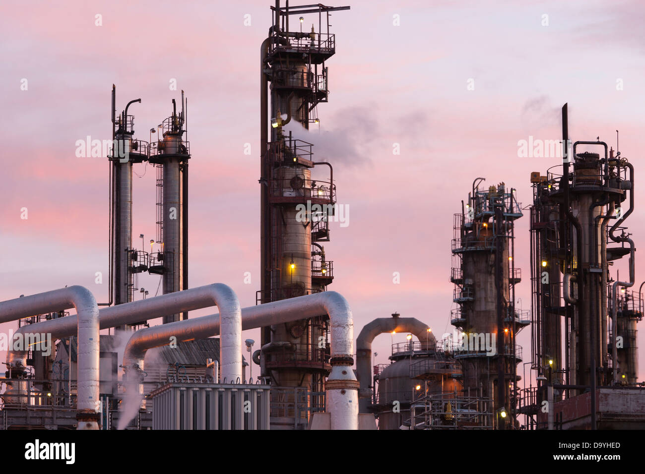 Close up view of oil refinery piping and towers Stock Photo - Alamy