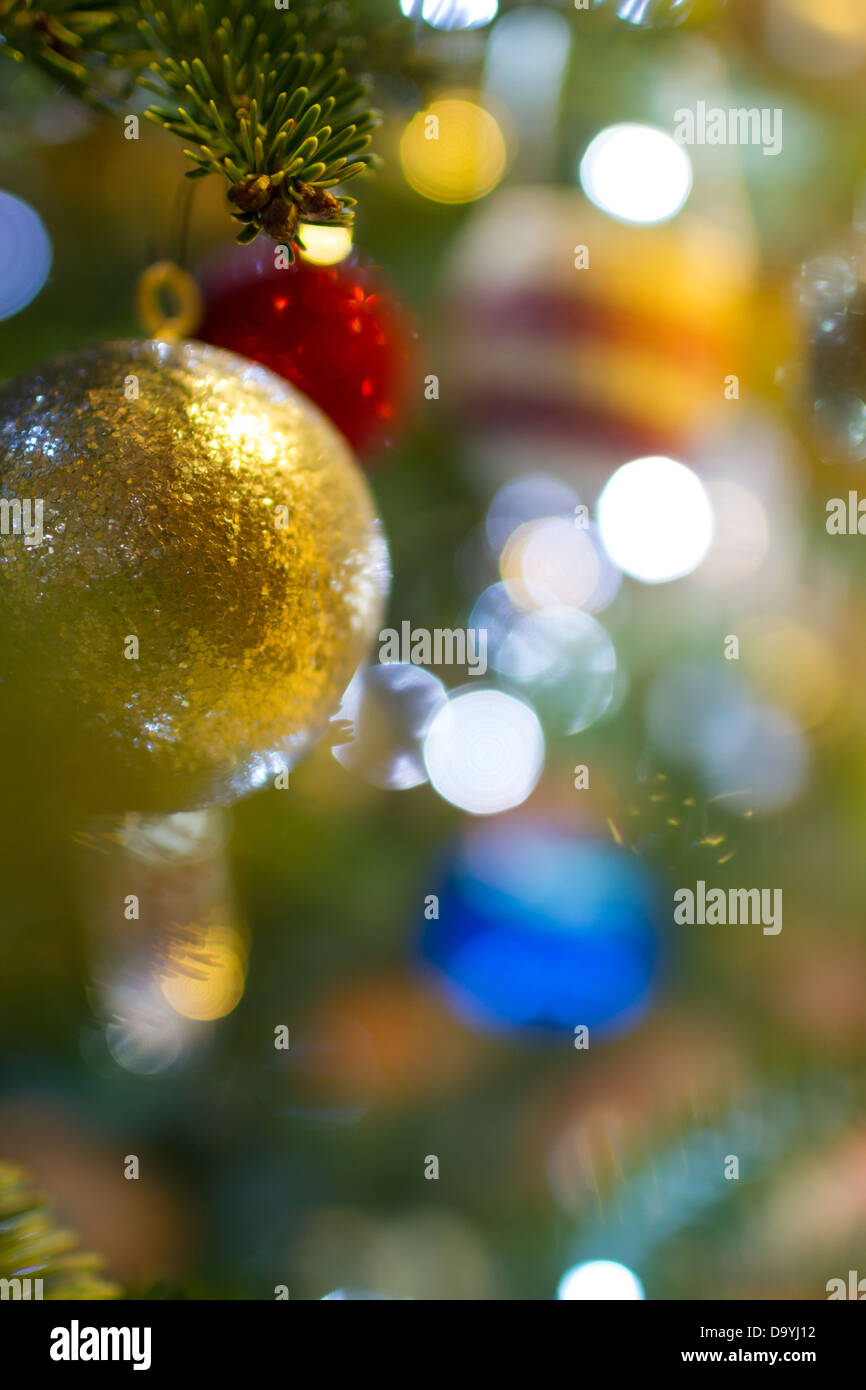 Christmas ornaments on a tree with lights Stock Photo - Alamy