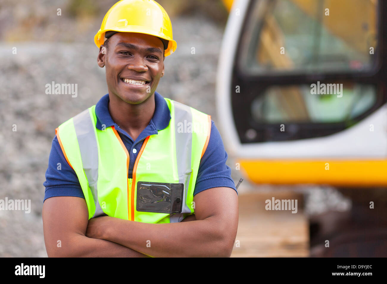 smiling African American industrial worker with arms crossed Stock ...