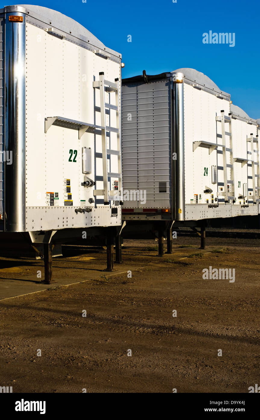 Semi trailers await their next load Stock Photo - Alamy