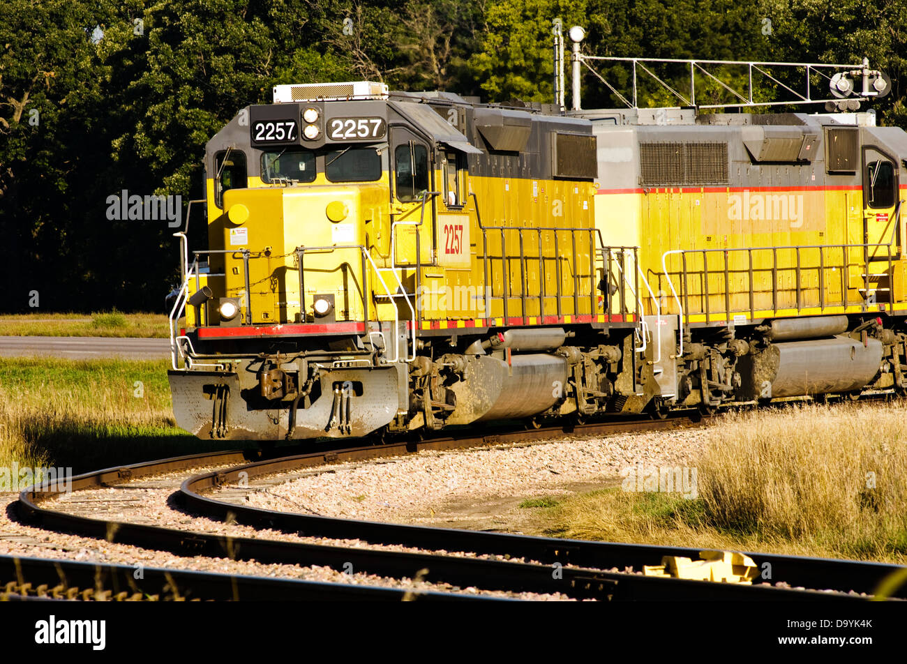 A pair of yellow railroad locomotives leave a spur track Stock Photo ...