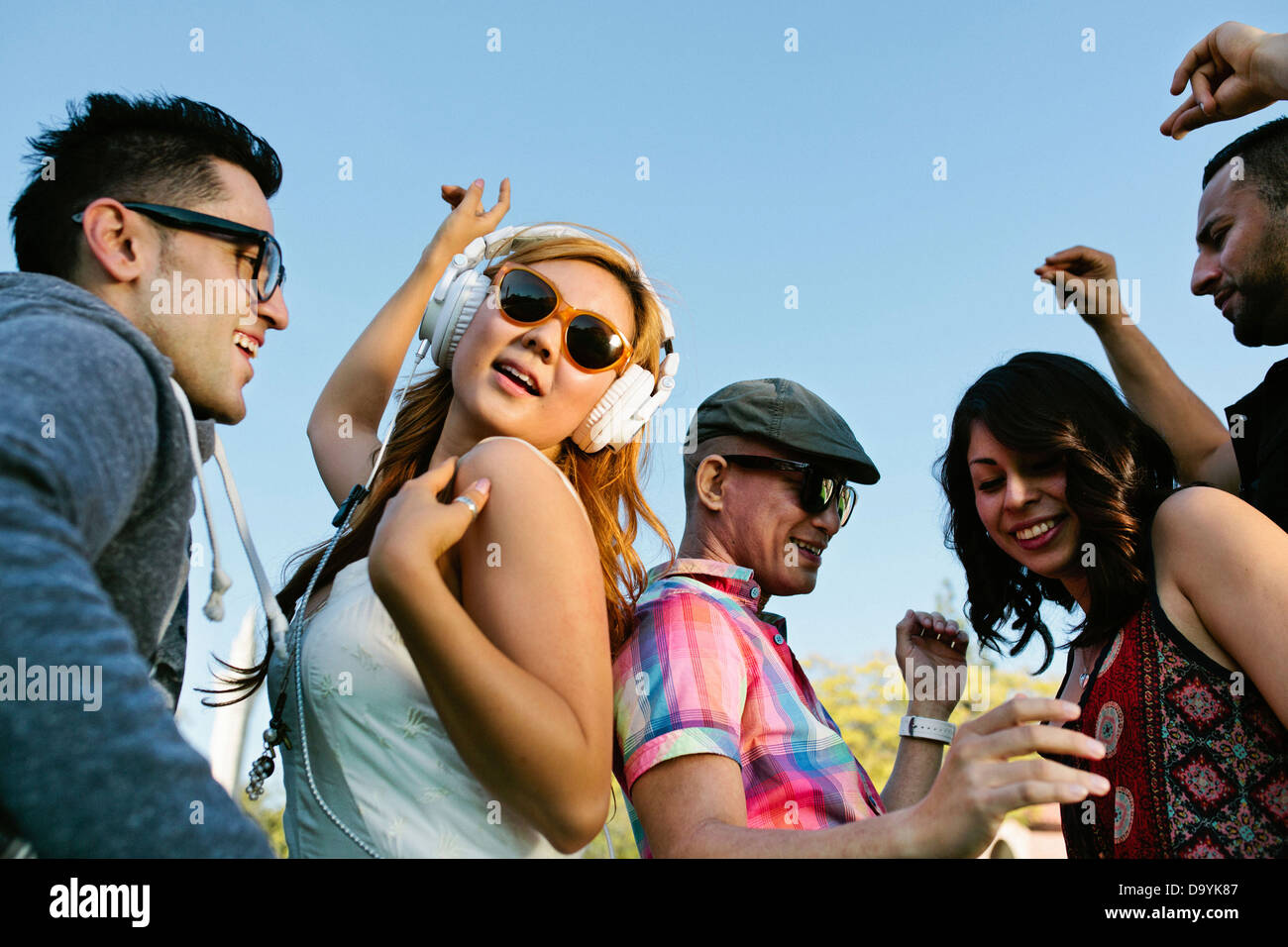 Group of people dancing and having fun together Stock Photo - Alamy