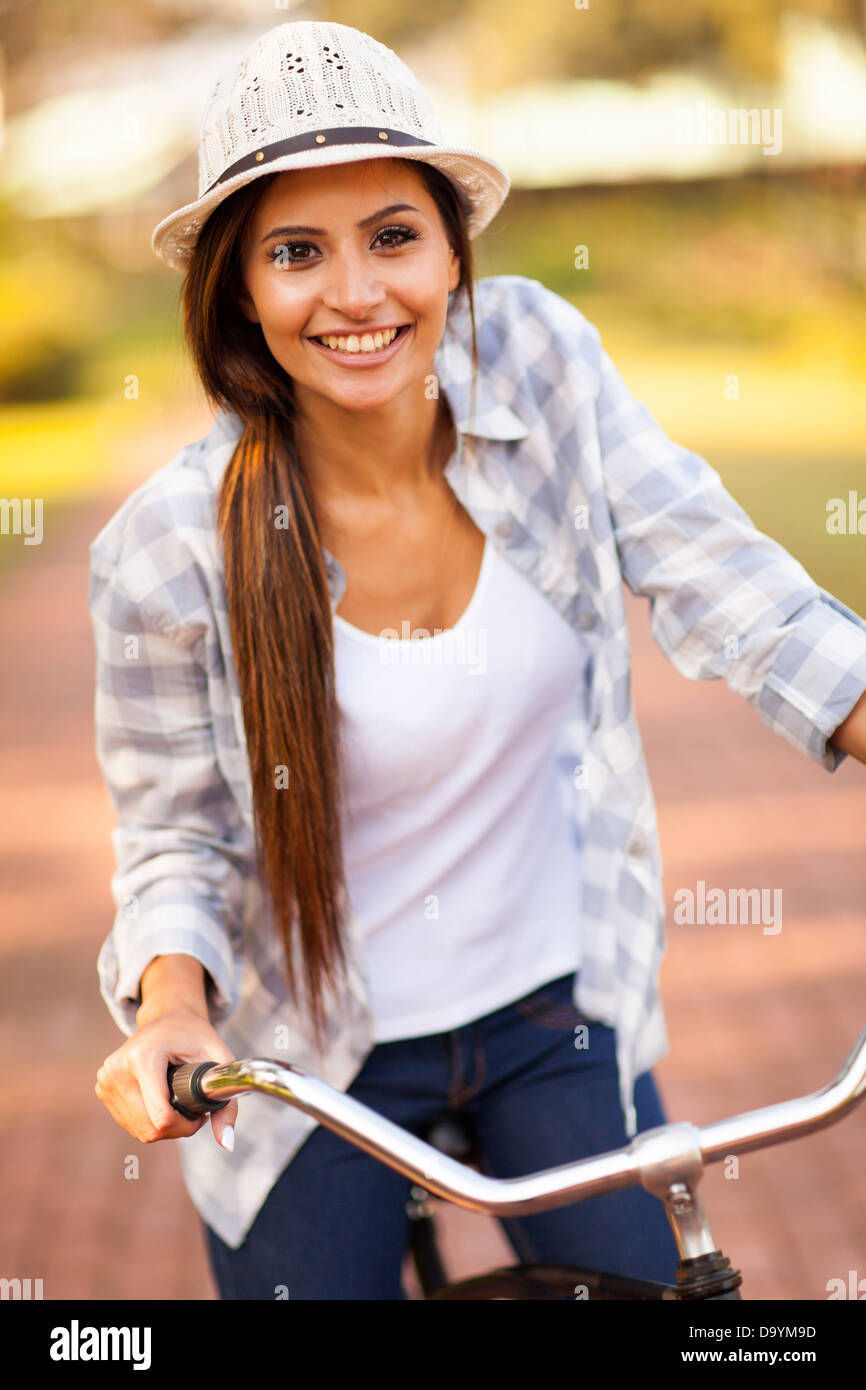 beautiful young woman riding a bicycle outdoors Stock Photo - Alamy