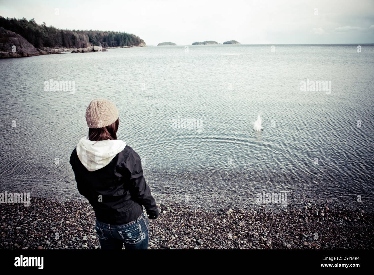 Woman throwing stone sea hi-res stock photography and images - Alamy