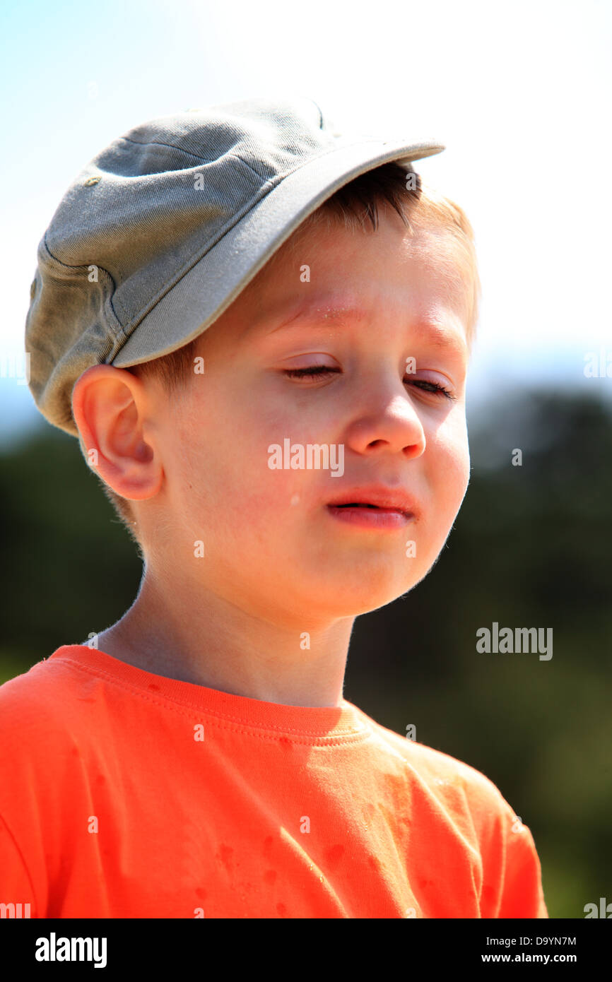 Sad child. Portrait of crying unhappy little boy outdoor Stock Photo ...