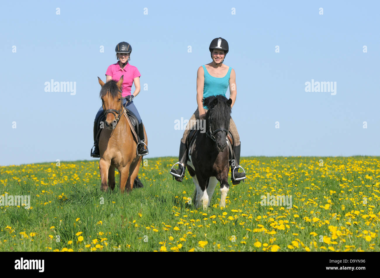 Two girls on ponies riding hi-res stock photography and images - Alamy