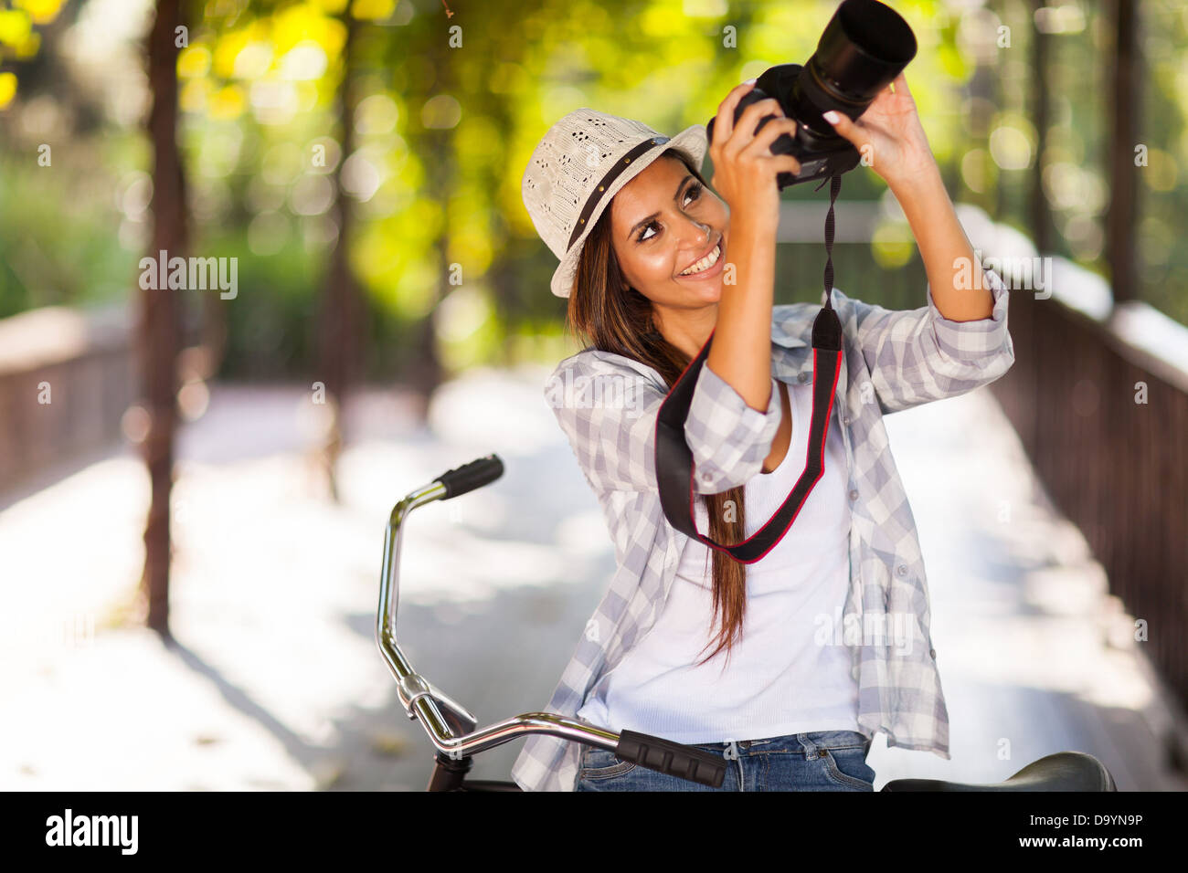 beautiful young woman taking photos outdoors Stock Photo - Alamy