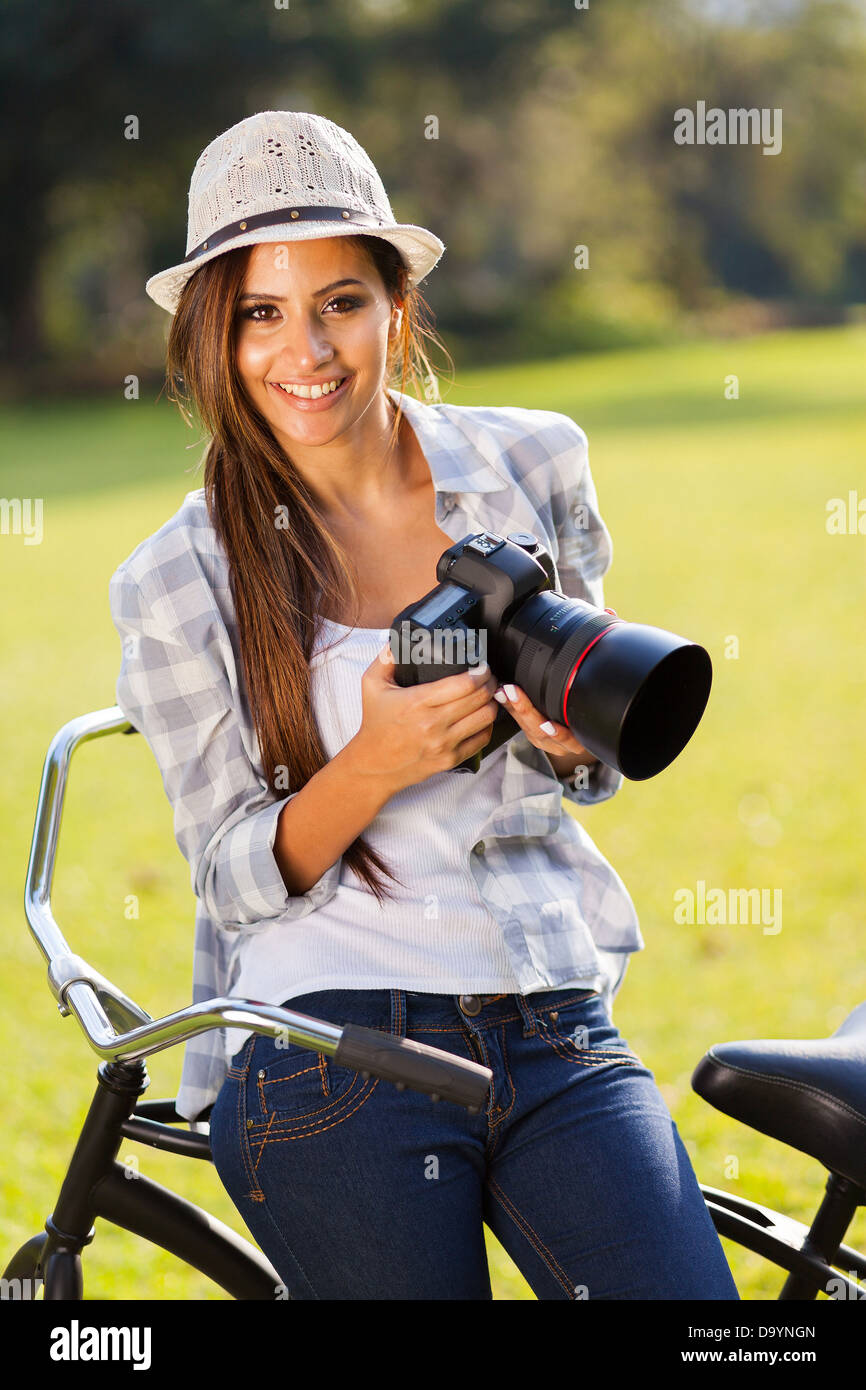 beautiful young woman holding camera outdoors Stock Photo - Alamy