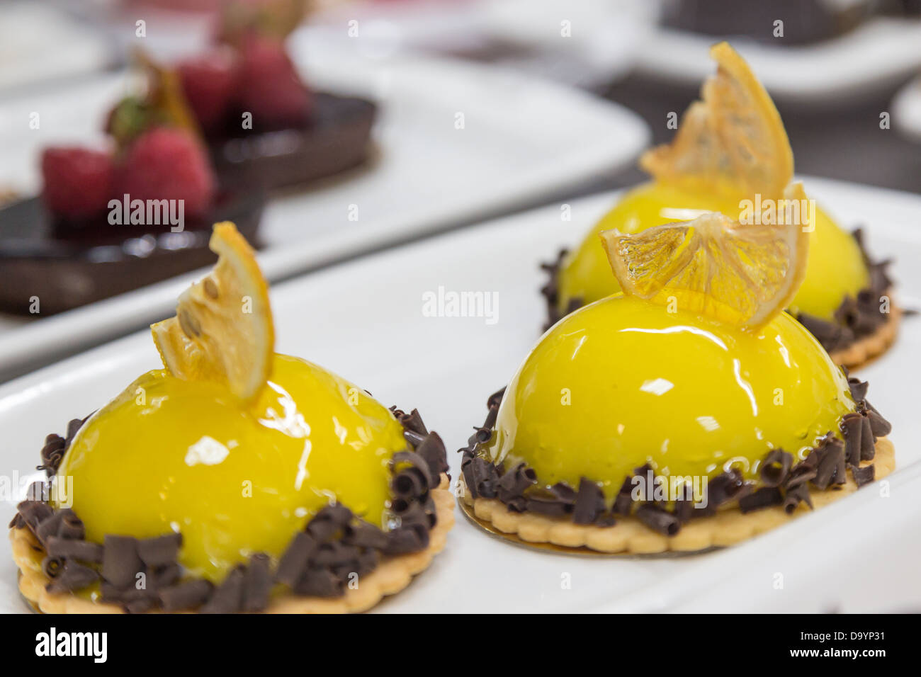fresh juice yellow lemon pastrys in show-window Stock Photo - Alamy
