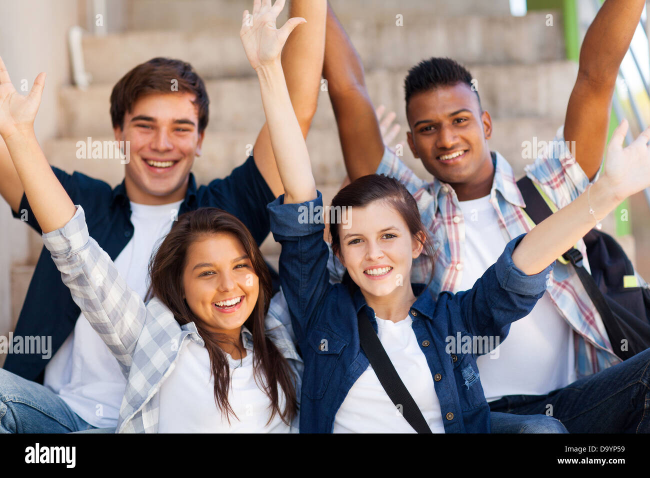 excited high school students with arms outstretched outdoors Stock ...