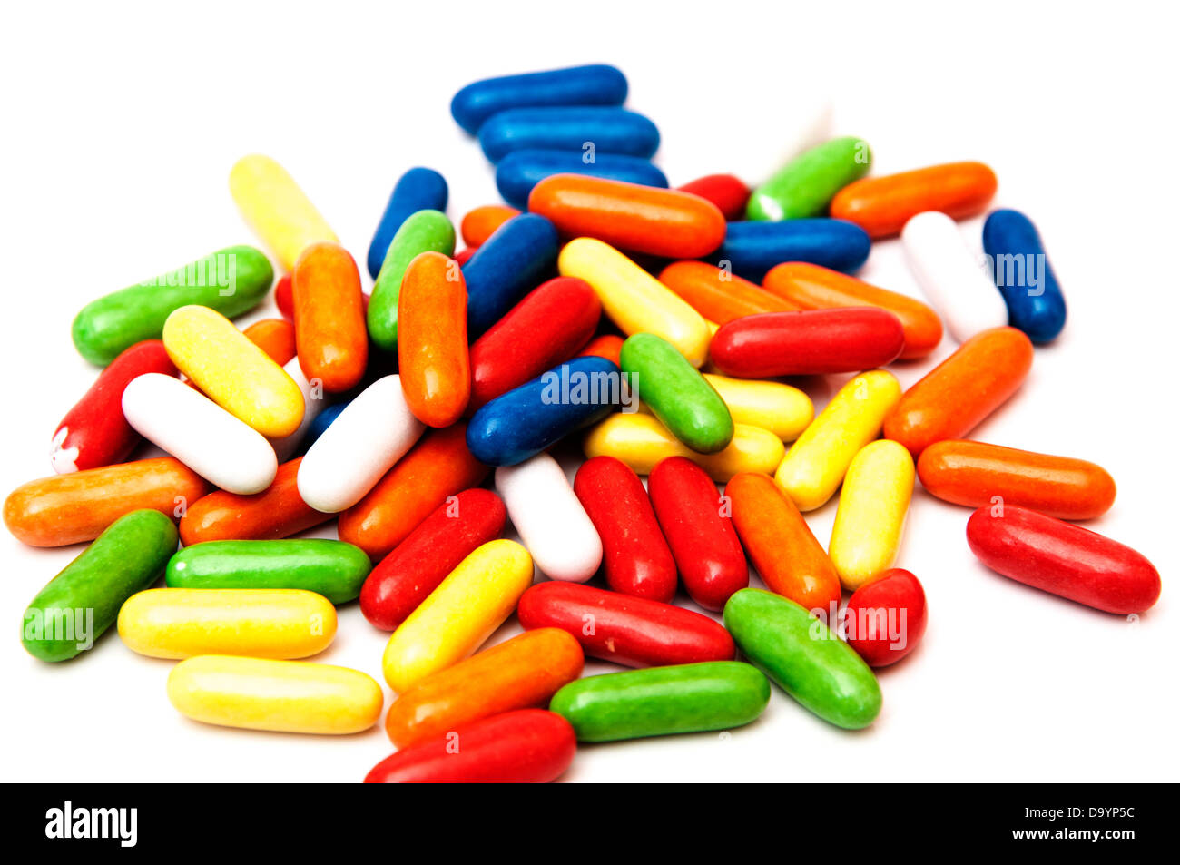 candy of many shapes and colors on white background Stock Photo - Alamy