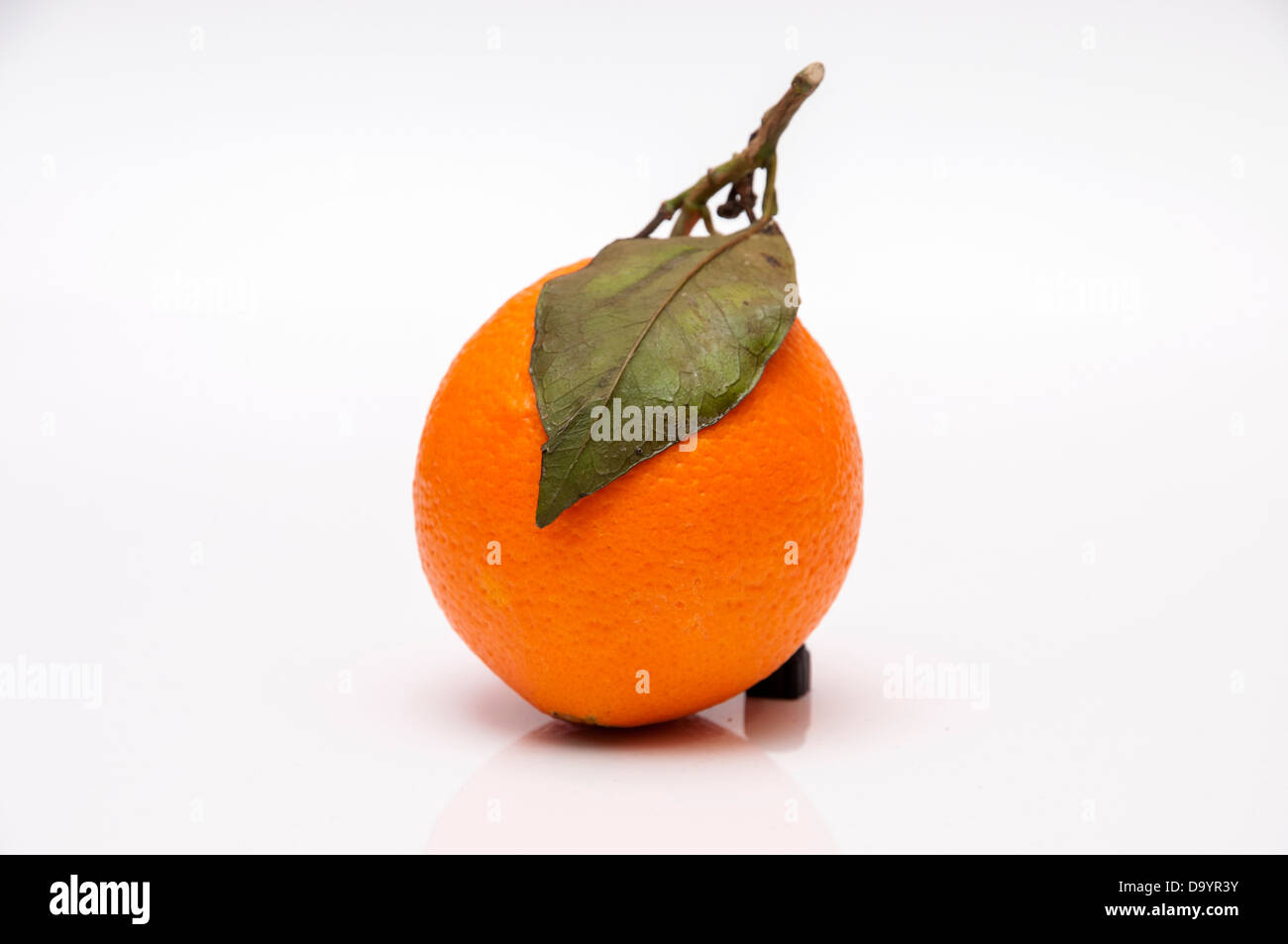 very sweet and juicy orange with leaf Stock Photo - Alamy
