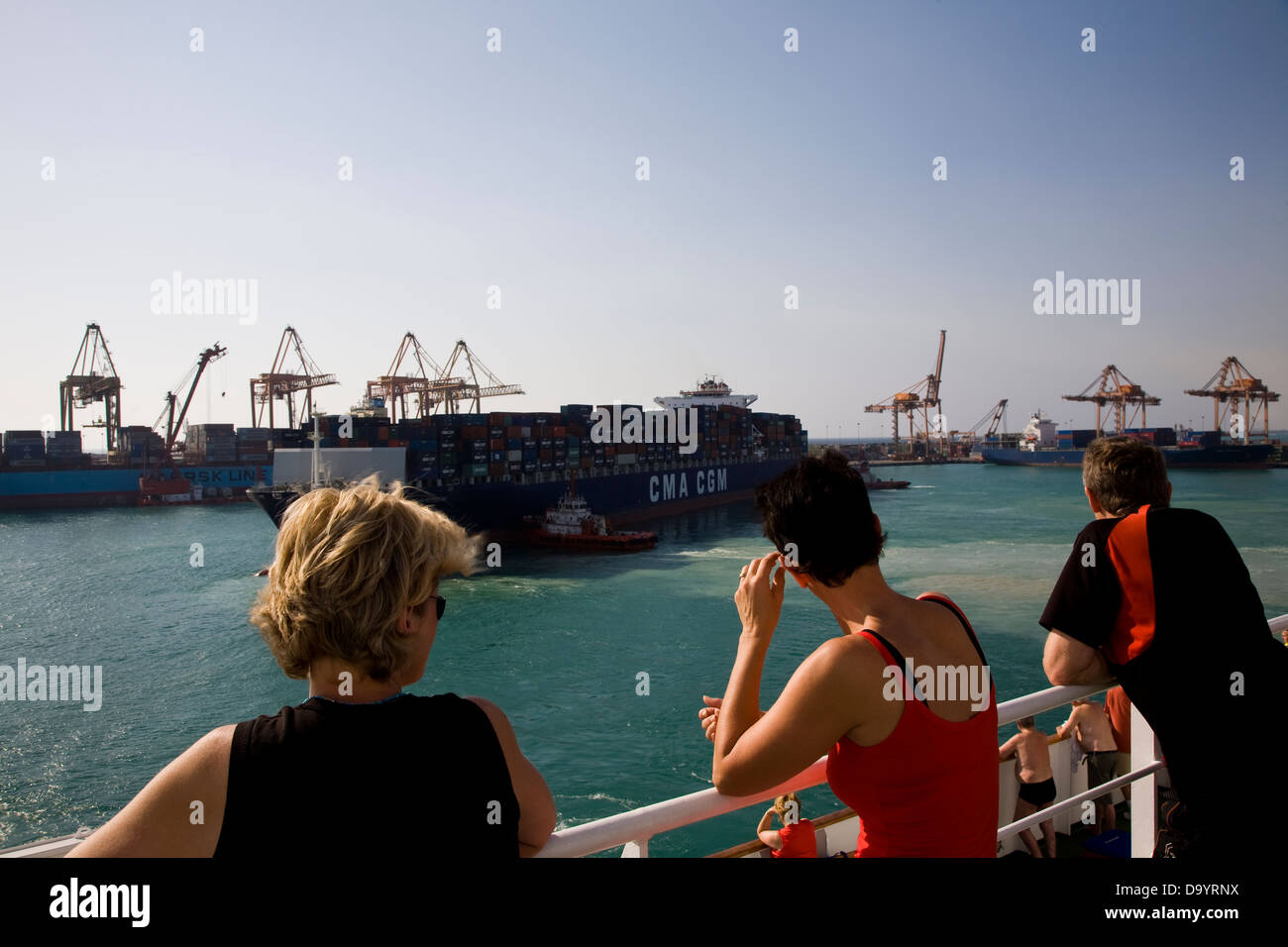 Passengers onboard the luxury cruise ship MS Deutschland observe ...