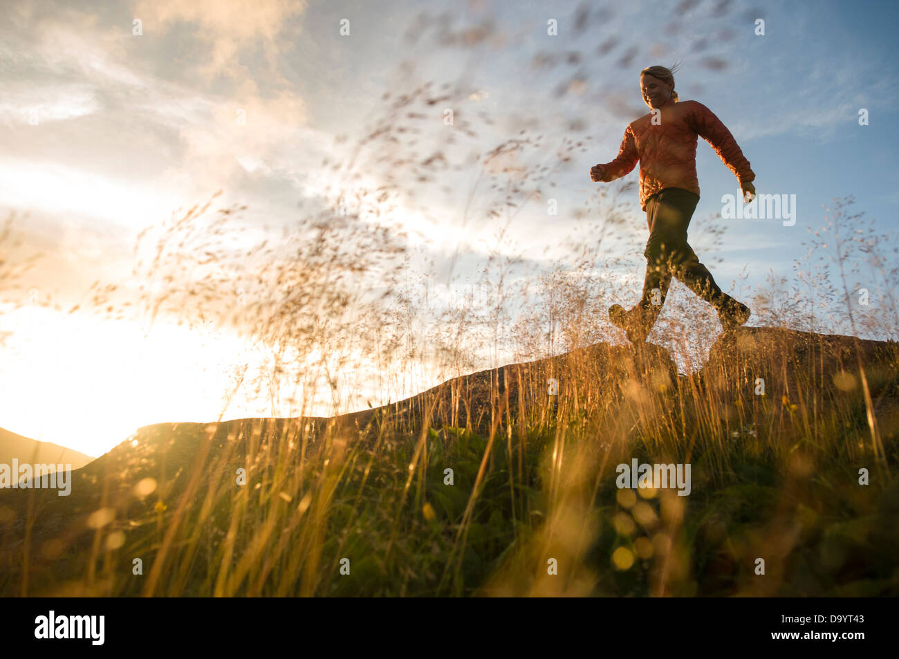 A woman walking along a rocky ridgeline on Grassy Ridge, Bakersville ...