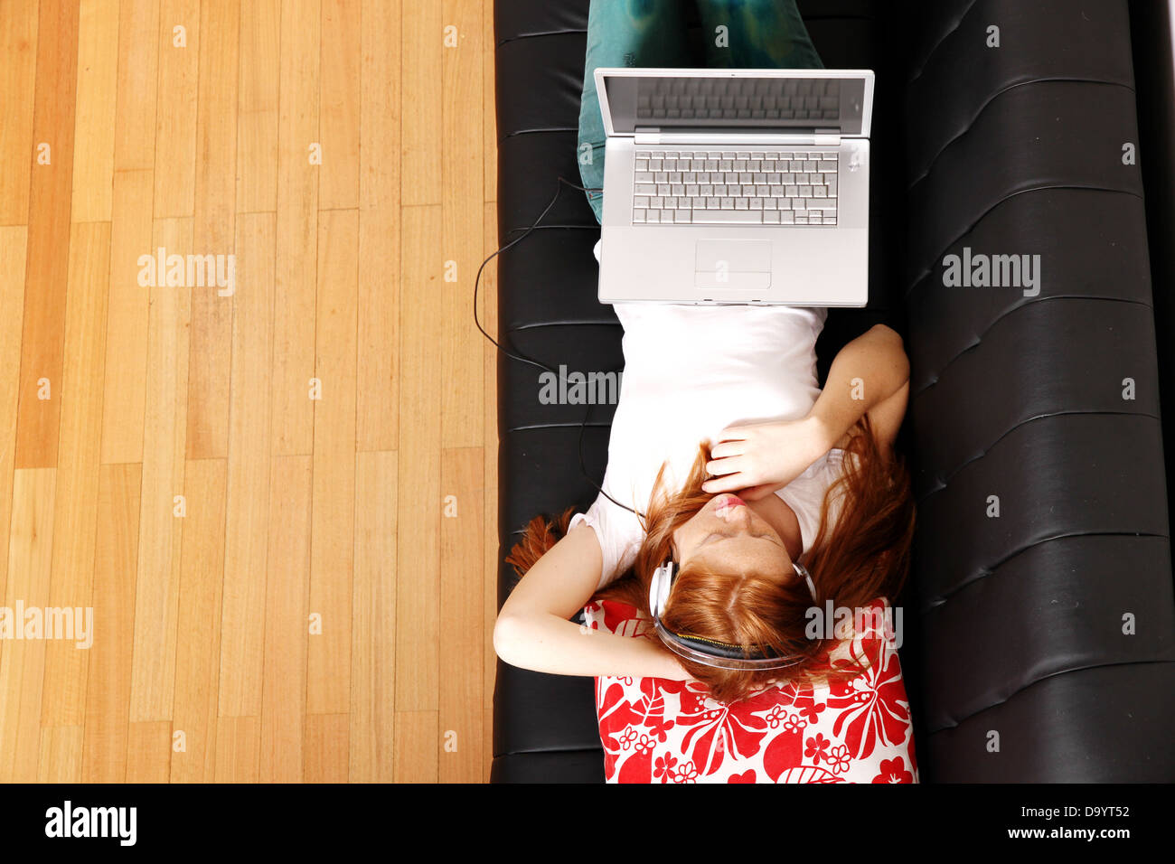 A young woman surfing on the Internet with a Laptop Stock Photo - Alamy
