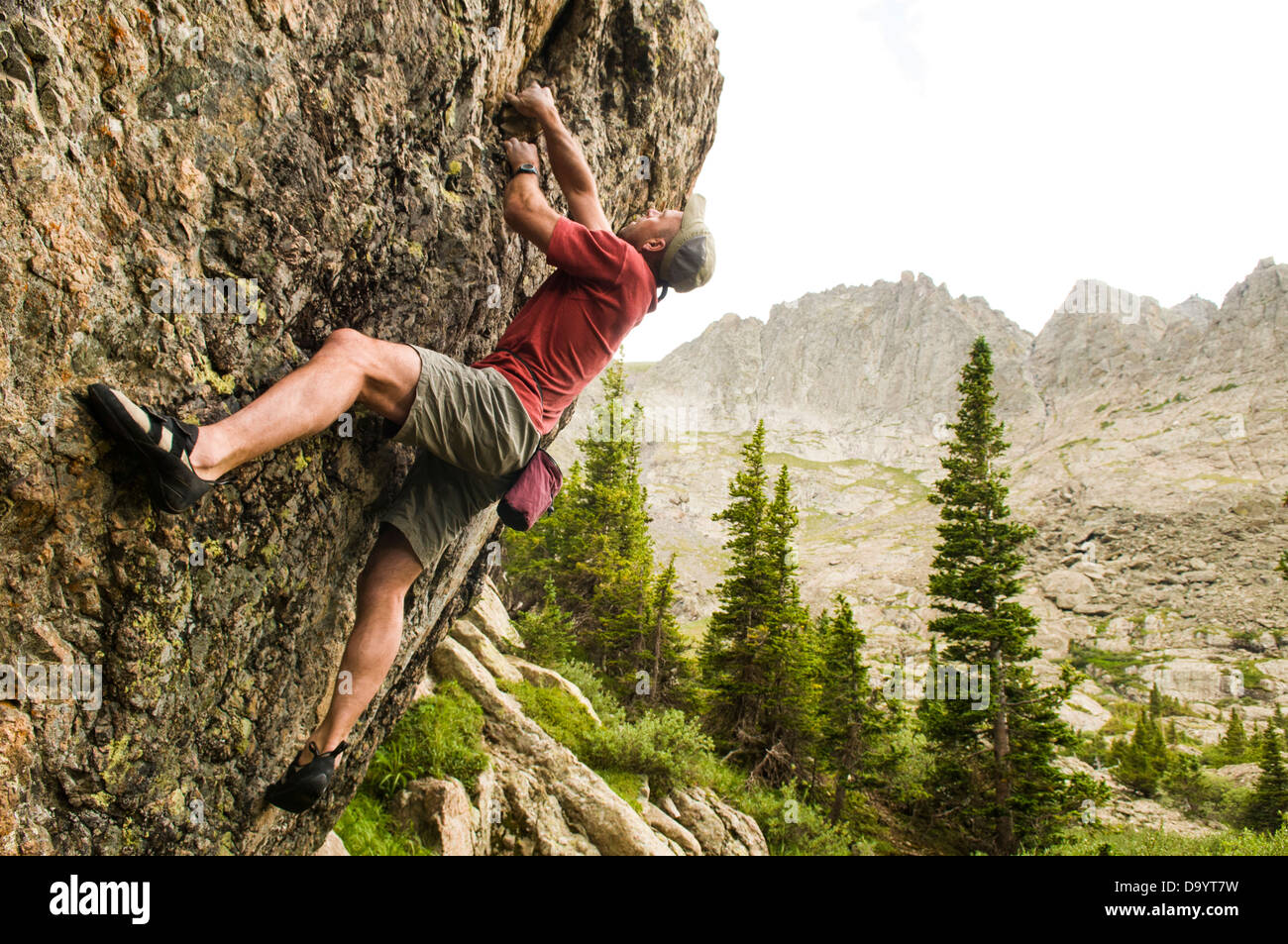 A man clinging to rock face in the, Sangre De Cristo Mountains, Rio ...