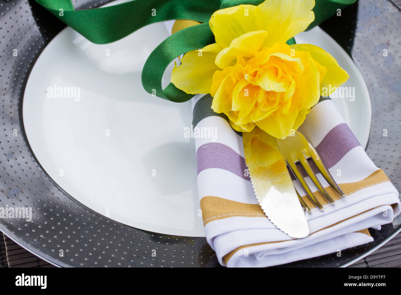 plate with cutlery and flower Stock Photo - Alamy