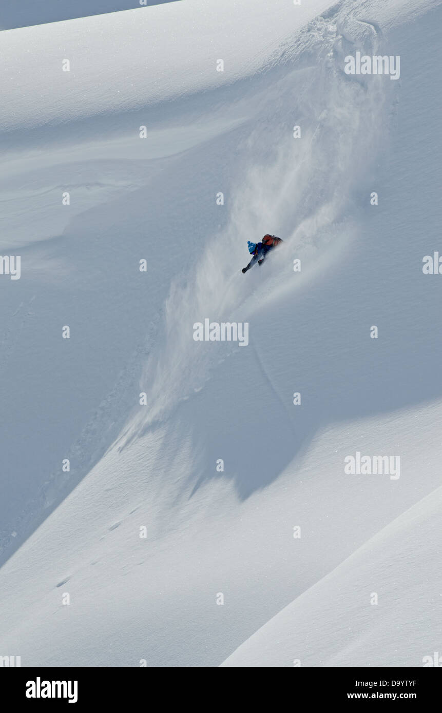 Low angle view of a person skiing against clear blue sky Stock Photo ...