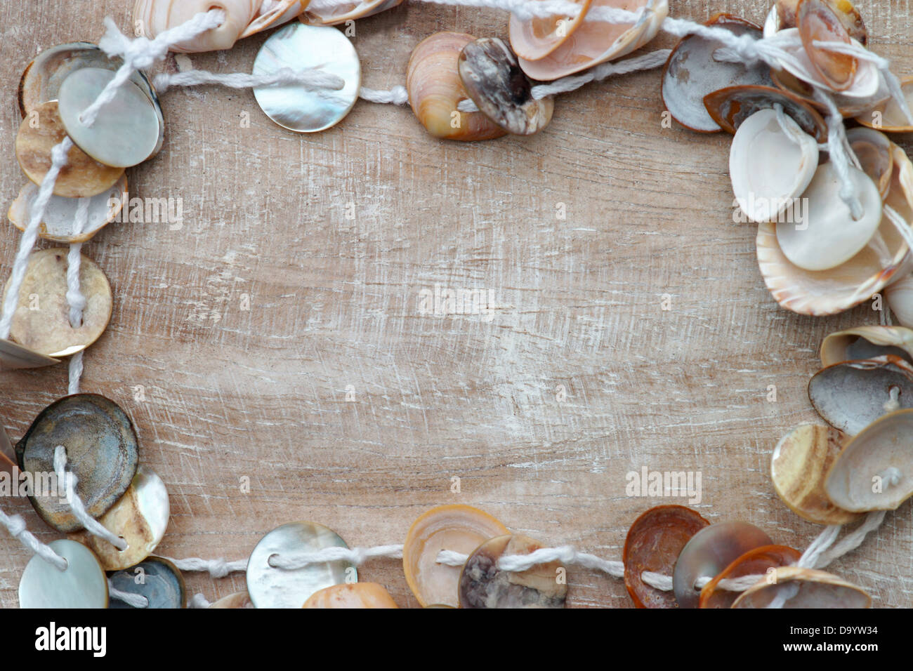Small shells necklace on wood background with copy space Stock Photo ...