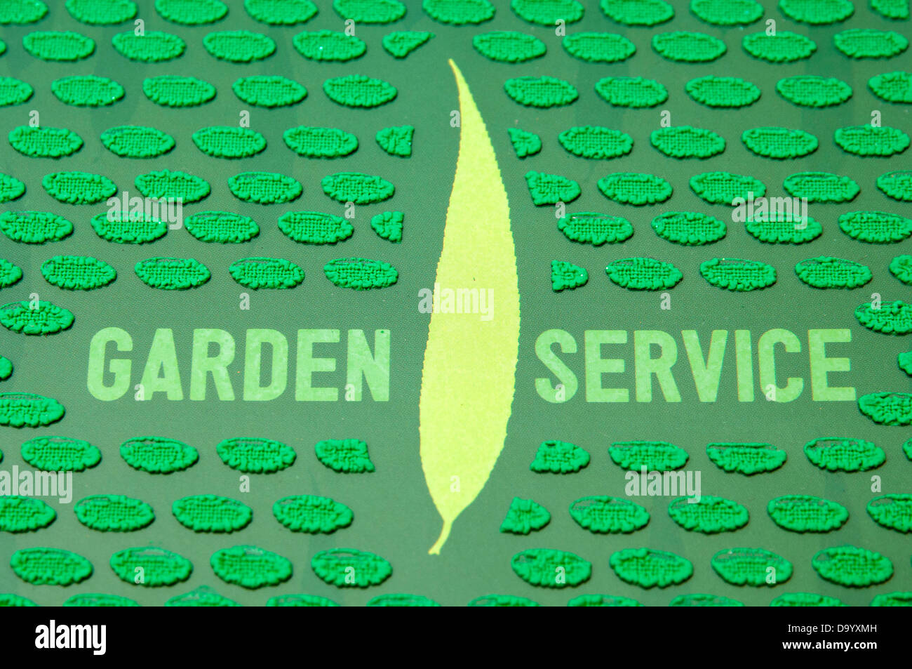 garden service on a green background Stock Photo - Alamy
