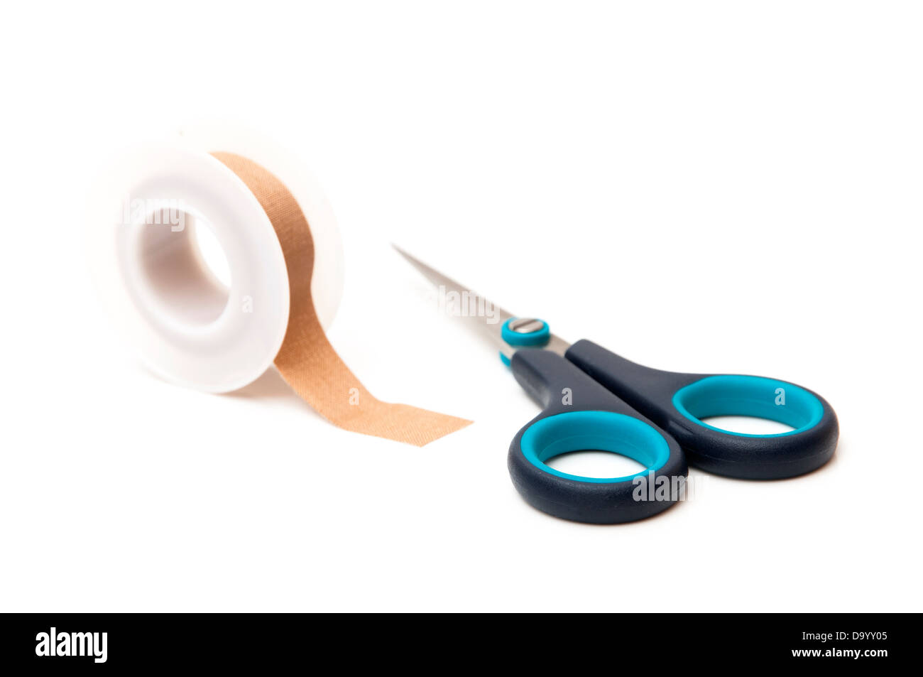 scissors with tape on a white background Stock Photo - Alamy