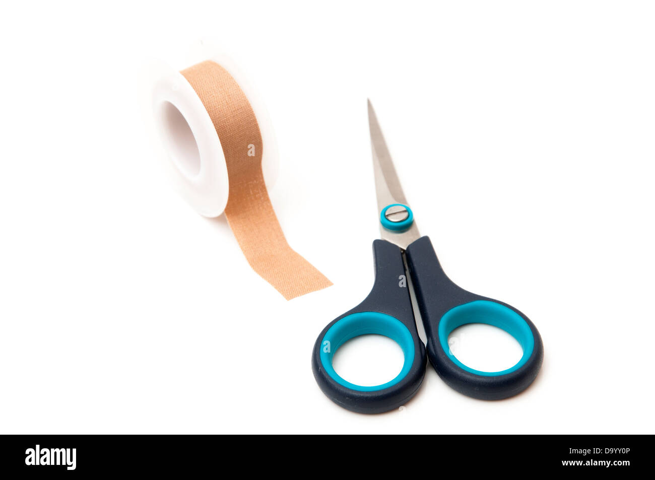 scissors with tape on a white background Stock Photo - Alamy