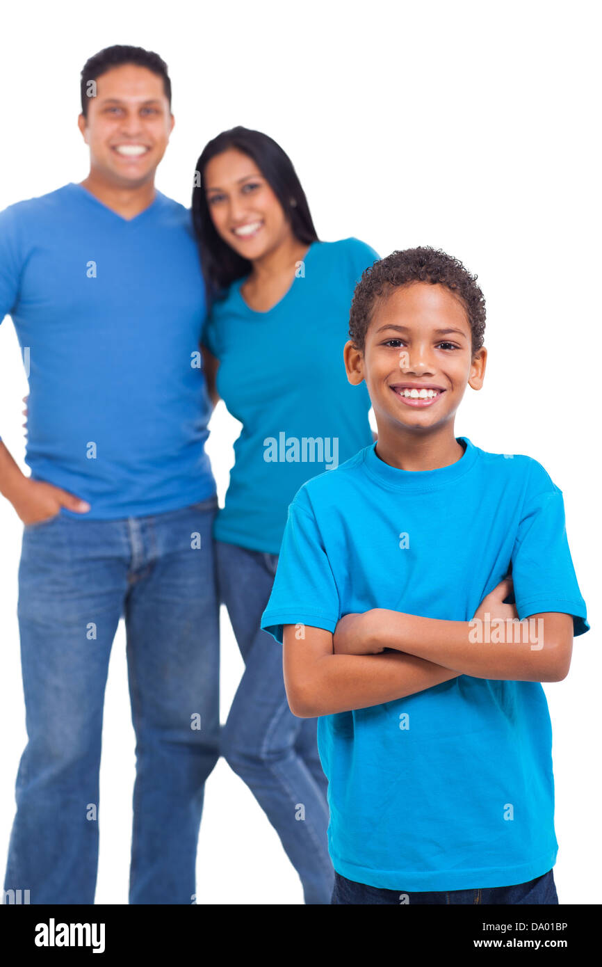 cute young boy standing in front of his parents over white background ...