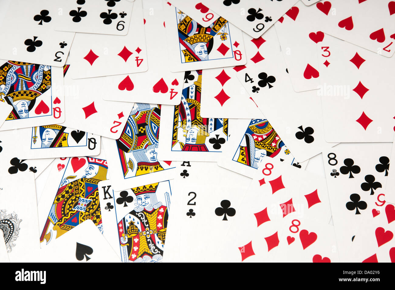 poker cards lying all over Stock Photo - Alamy