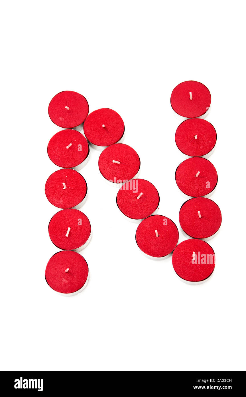 Letter N formed by candles on a white background Stock Photo - Alamy