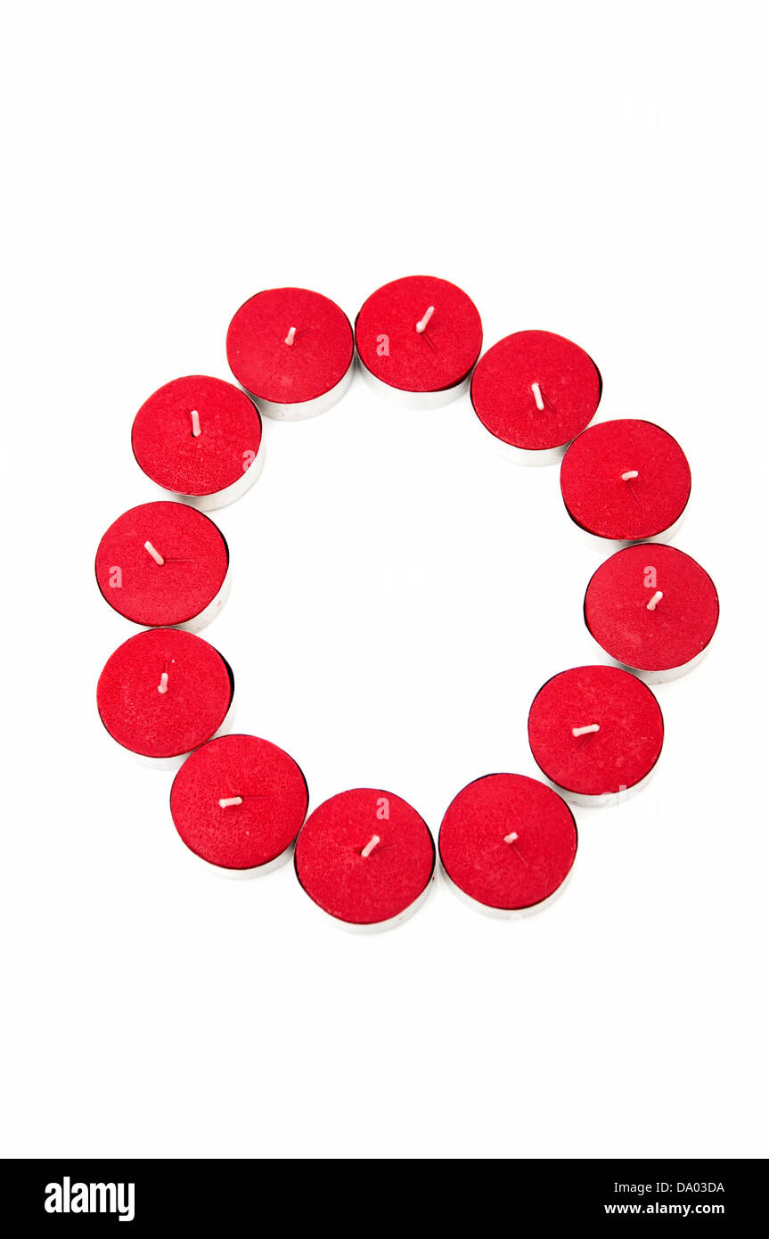 Letter O formed by candles on a white background Stock Photo - Alamy