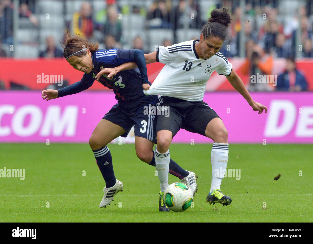 Germany's Celia Okoyino da Mbabi (R) vies for the ball with Japan's ...