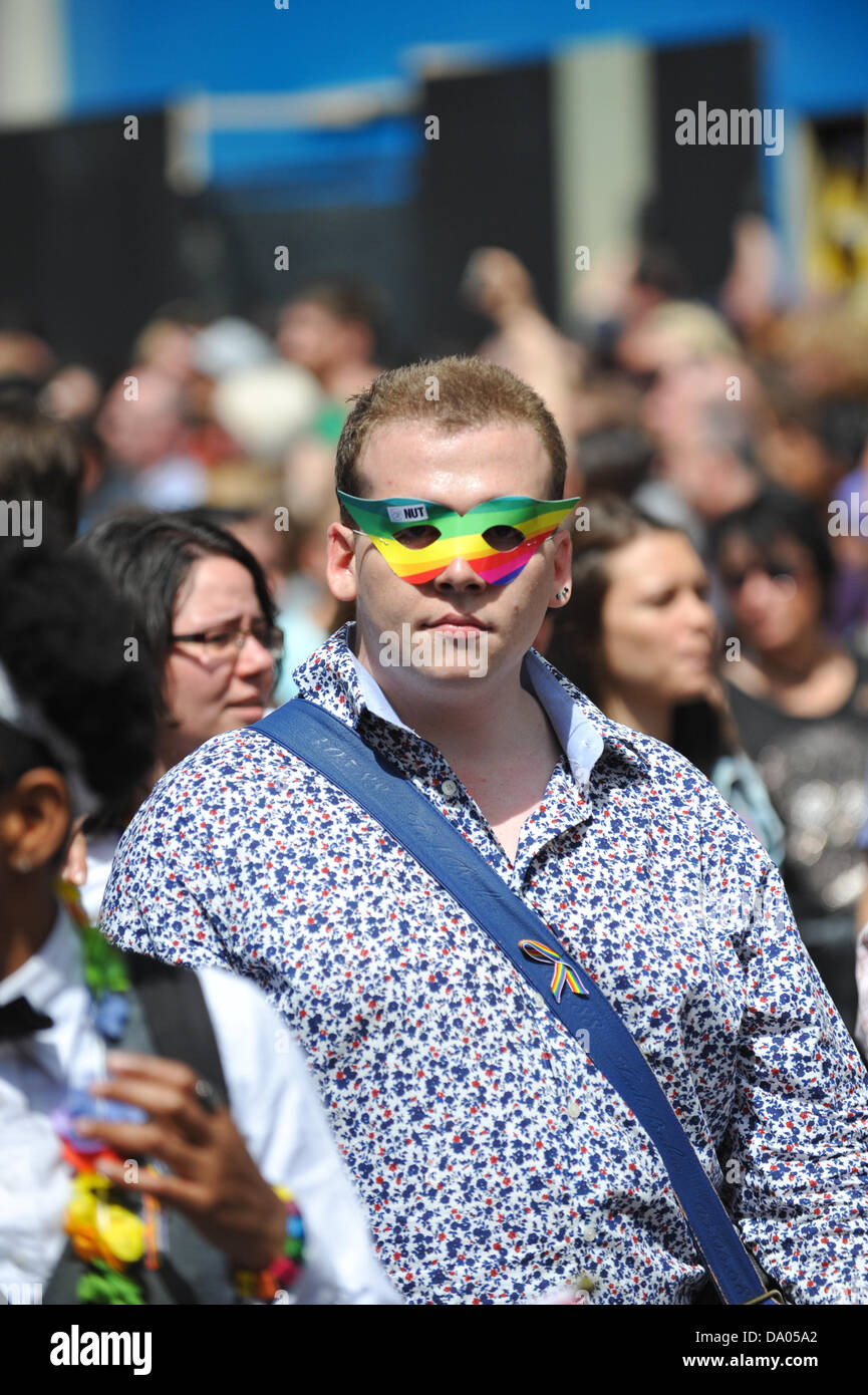 Regent Street, London, UK. 29th June 2013. A man with a rainbow mask in ...