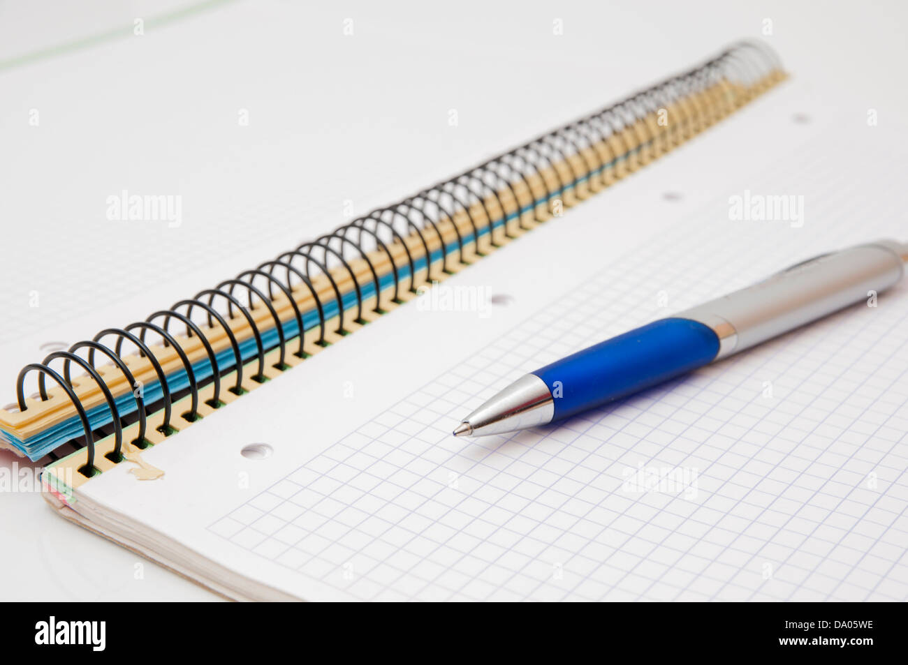 notepad with pen on a white background Stock Photo - Alamy
