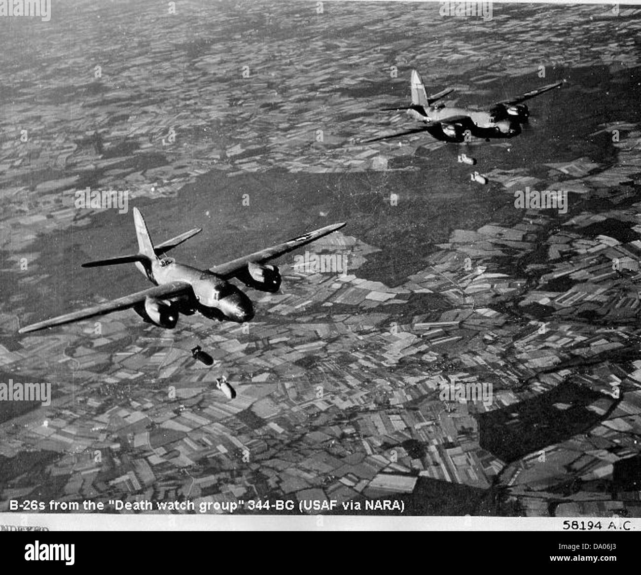 This image depicts a B-24 Liberator bomber from the 394th Bomb Group ...