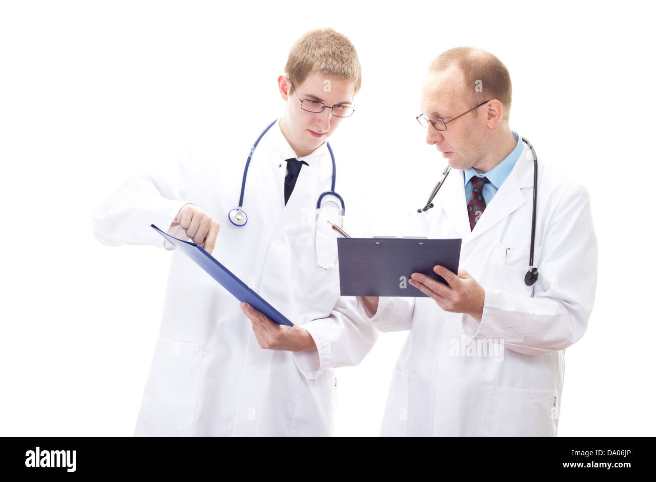 Team of male doctors comparing their documents Stock Photo - Alamy