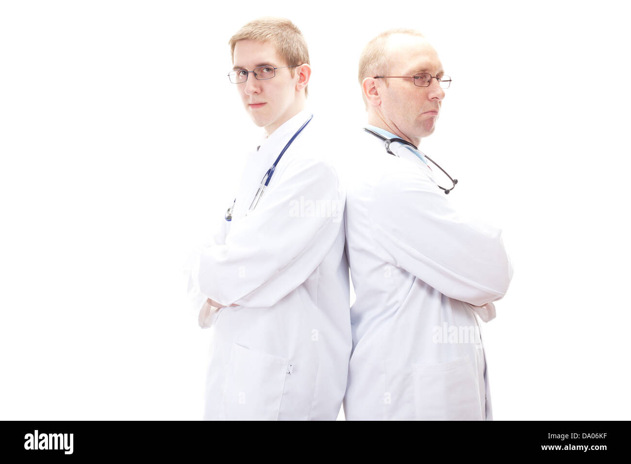 Two male doctors standing back-to-back Stock Photo - Alamy