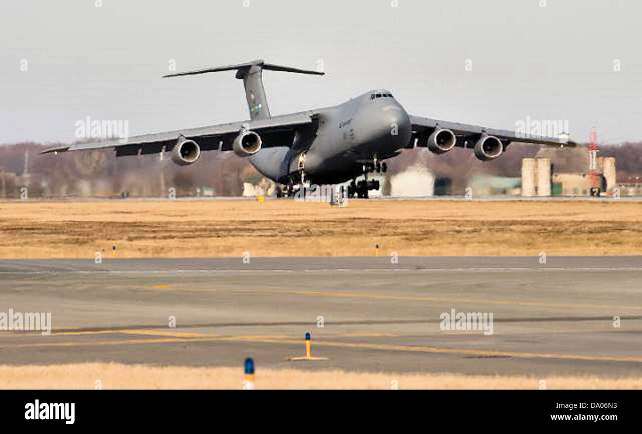 This image features a C-5M Super Galaxy, a military transport aircraft ...