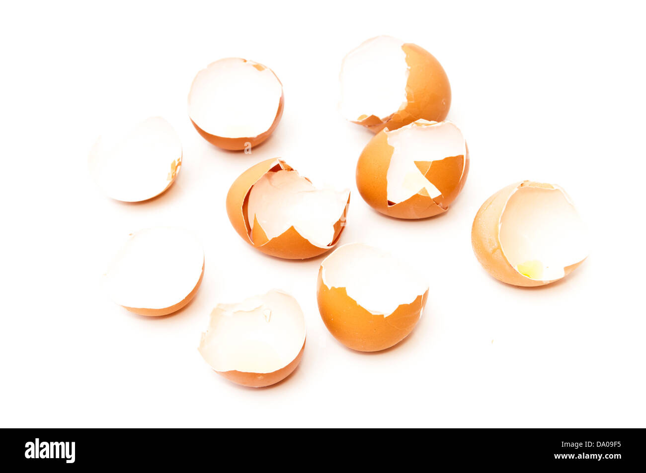 broken eggs on a white background Stock Photo - Alamy