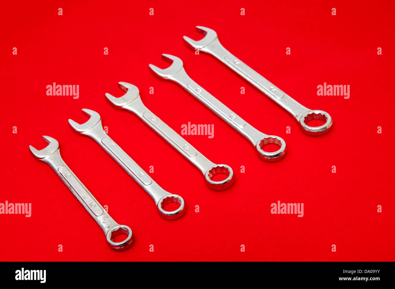 industrial tools on a red background Stock Photo - Alamy
