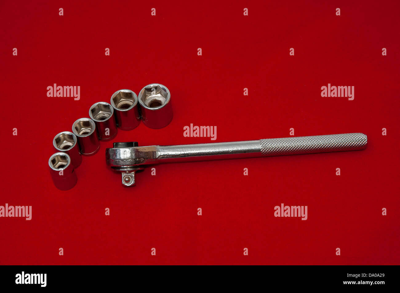 industrial tools on a red background Stock Photo - Alamy