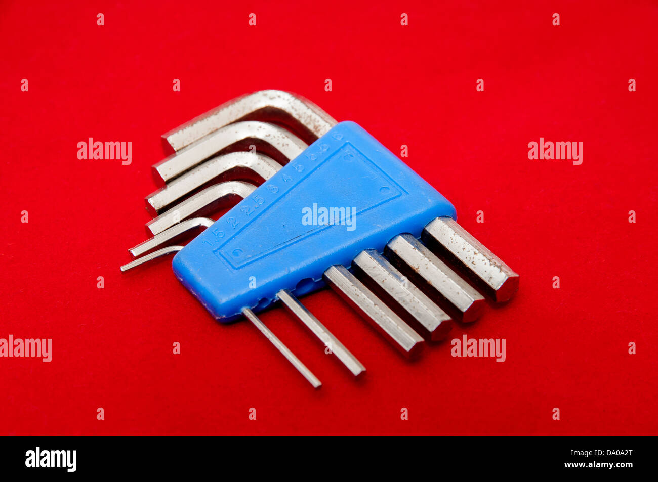 industrial tools on a red background Stock Photo - Alamy