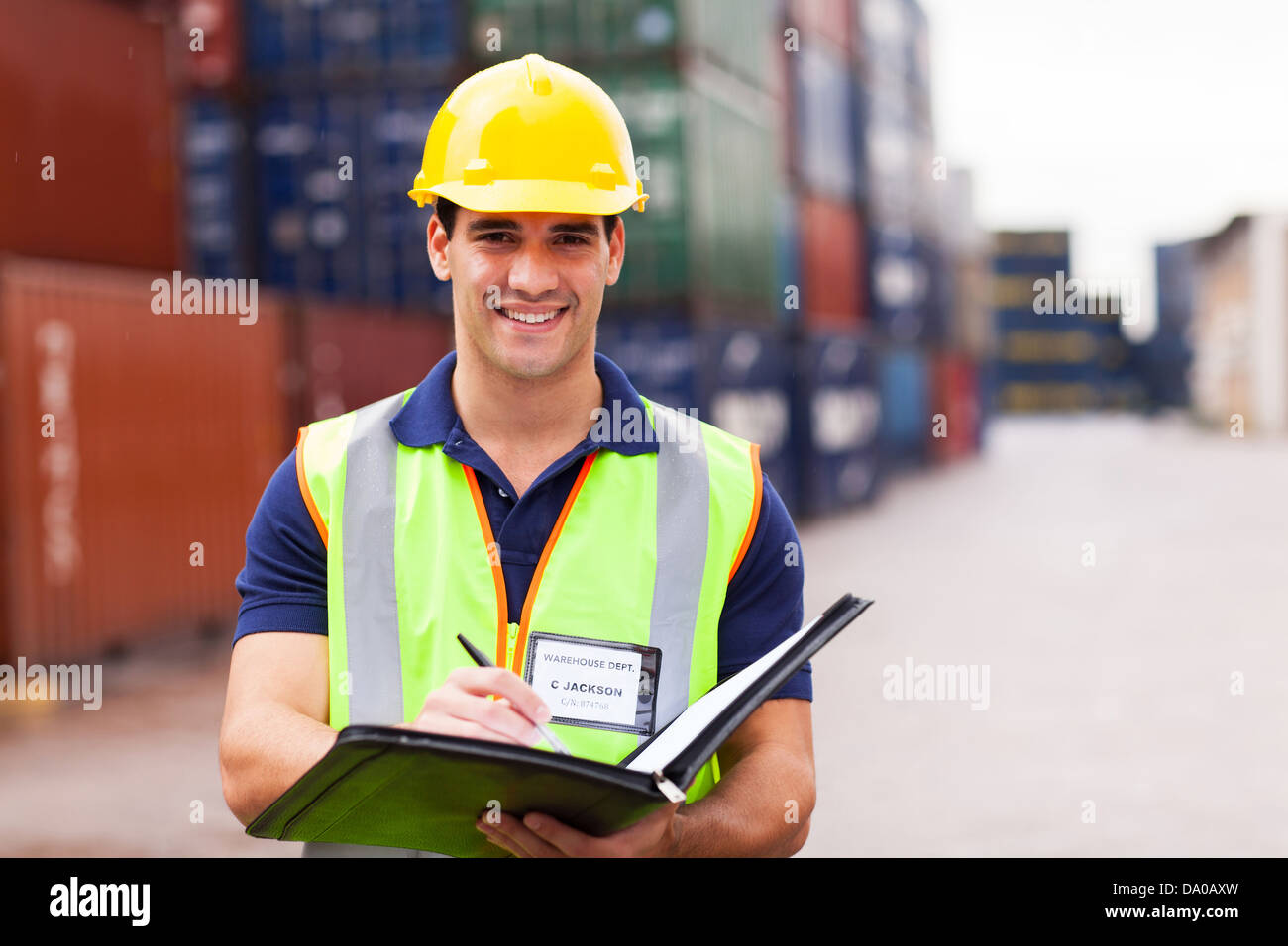 young harbor container depot worker Stock Photo - Alamy