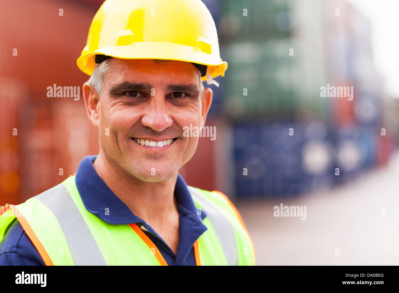 happy senior harbor worker at container depot Stock Photo - Alamy