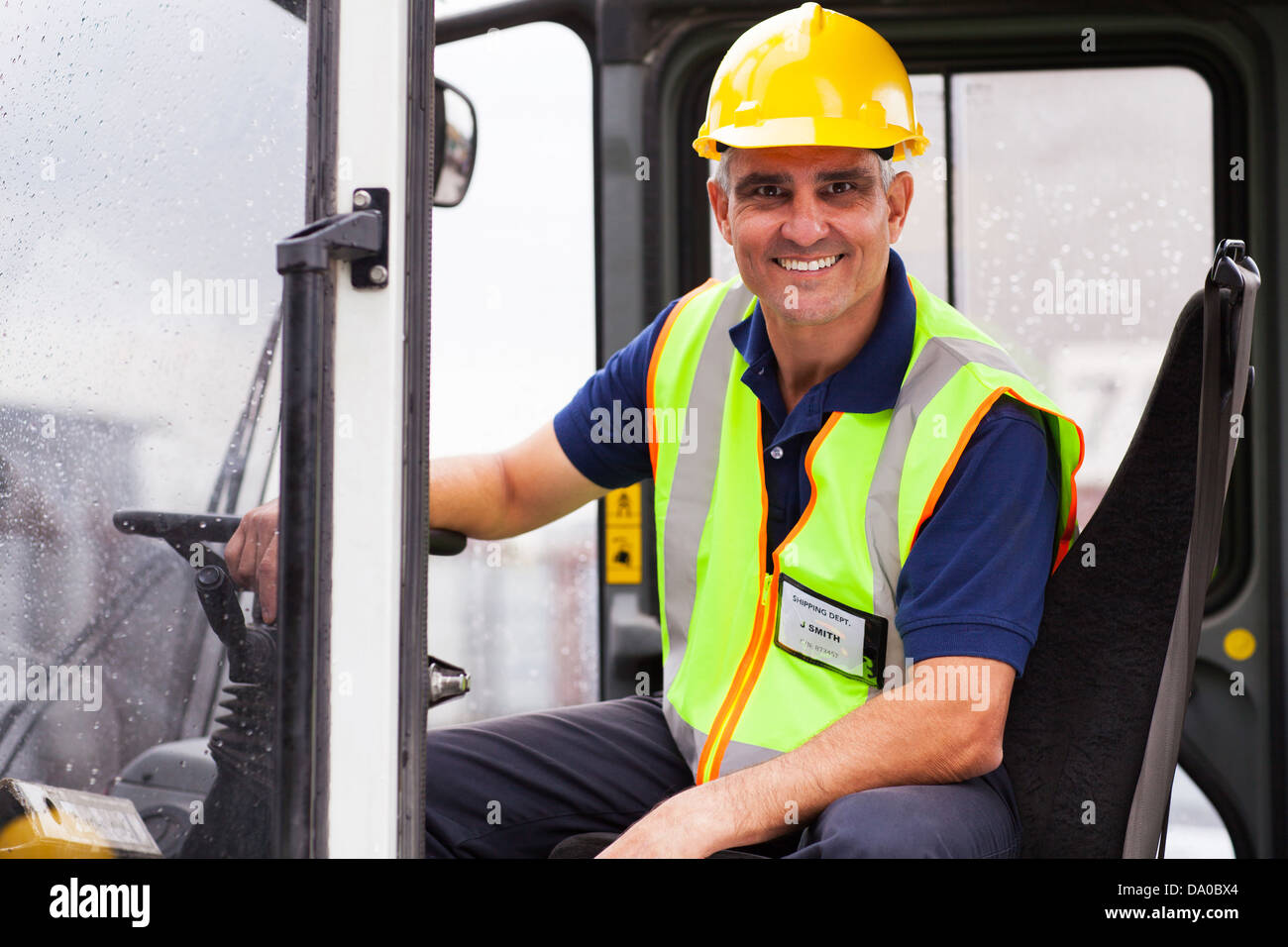 cheerful middle aged forklift operator Stock Photo - Alamy cheerful middle aged forklift operator Stock Photo - Alamy