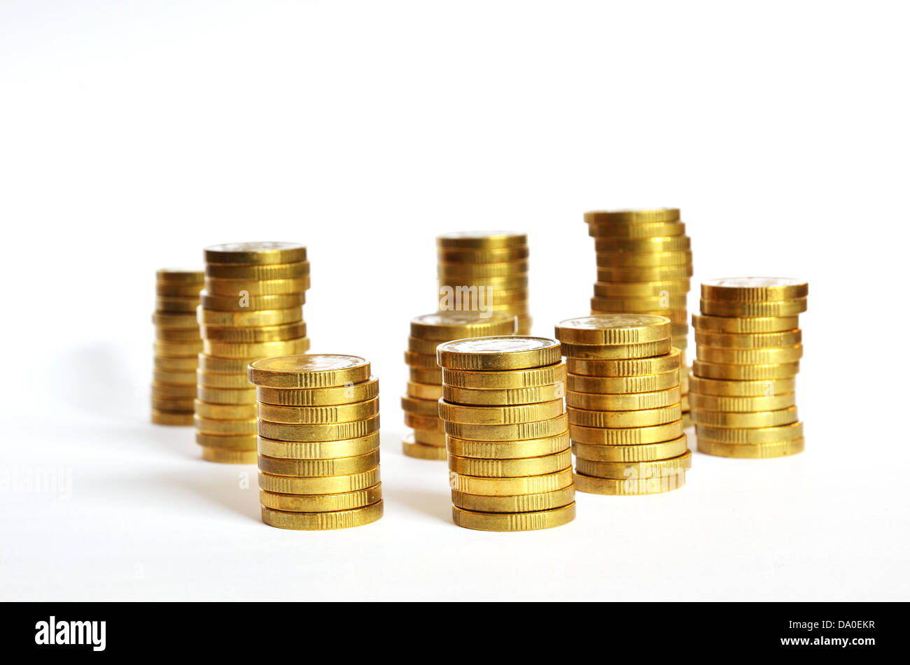 Golden coin piles Stock Photo - Alamy