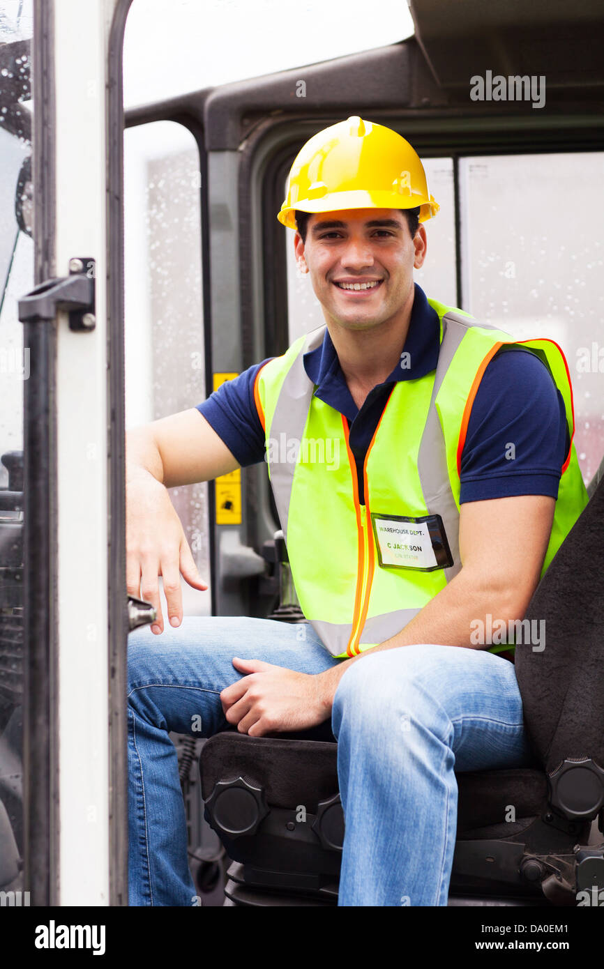 portrait of smiling young forklift driver Stock Photo - Alamy
